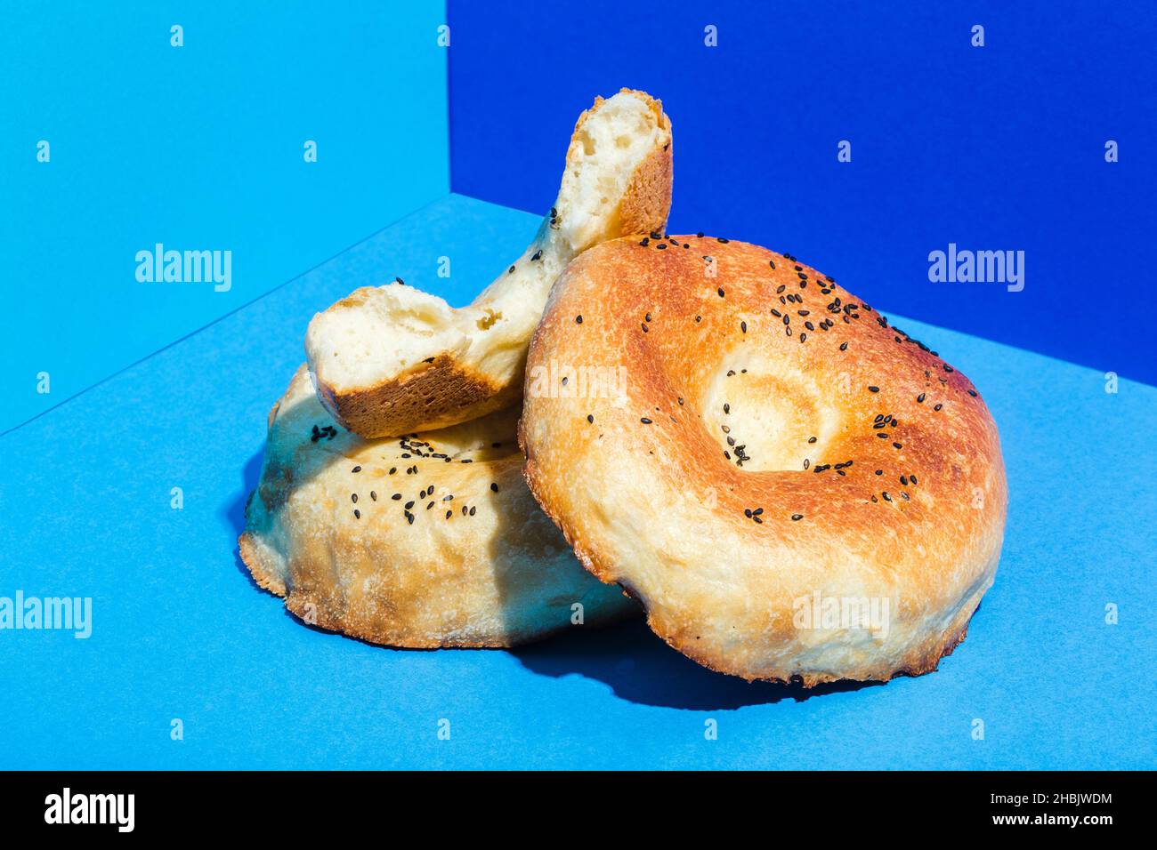 Uzbek national food Tandyr bread Lepeshka with cheese on blue ...