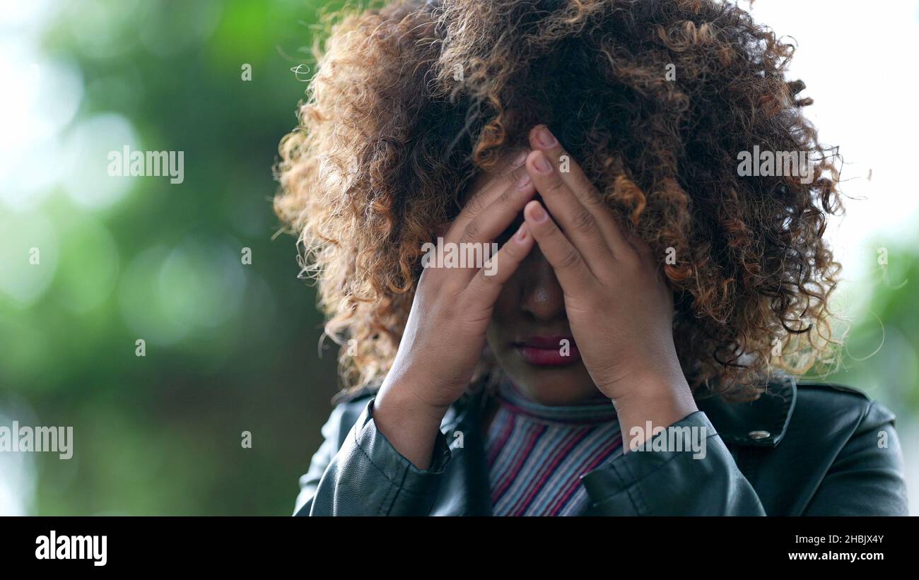 Concerned African woman feeling anxiety and problems Stock Photo - Alamy