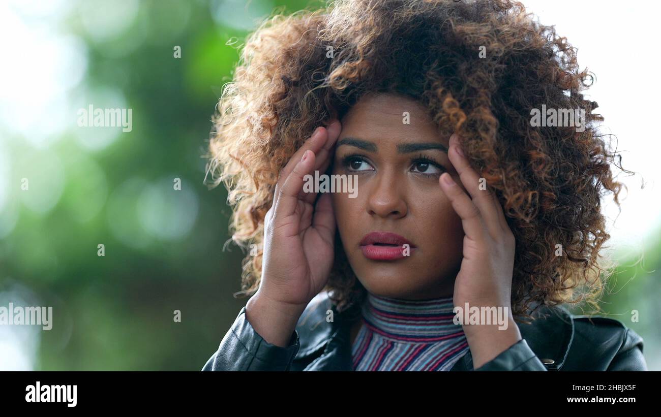 Concerned African woman feeling anxiety and problems Stock Photo - Alamy