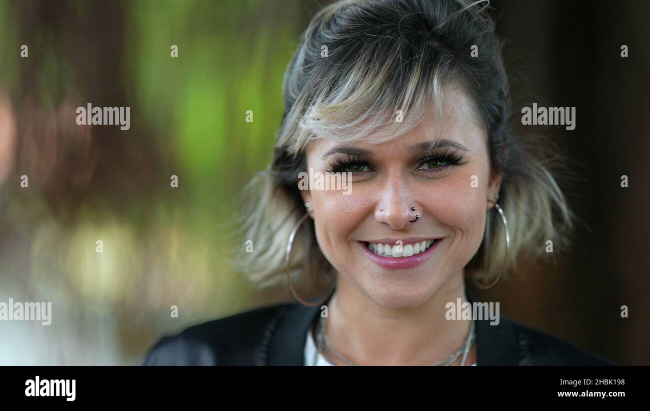 Happy blond woman smiling portrait close-up real life laugh and smile ...