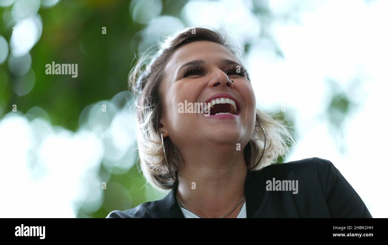 Happy woman spontaneous laugh and smile. Person real life authentic ...