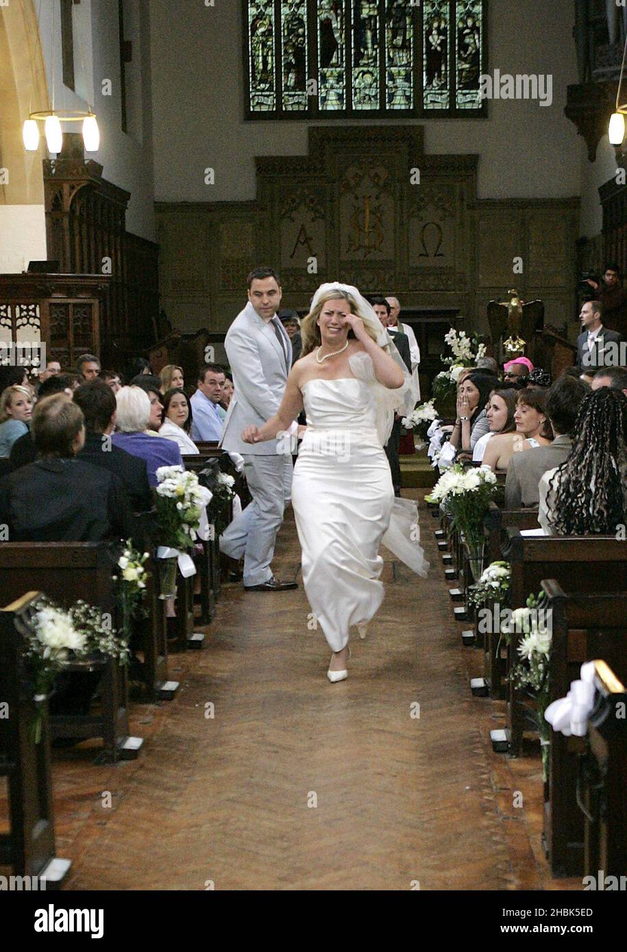Bride Victoria Kruger runs from the altar in St Luke's Church in ...