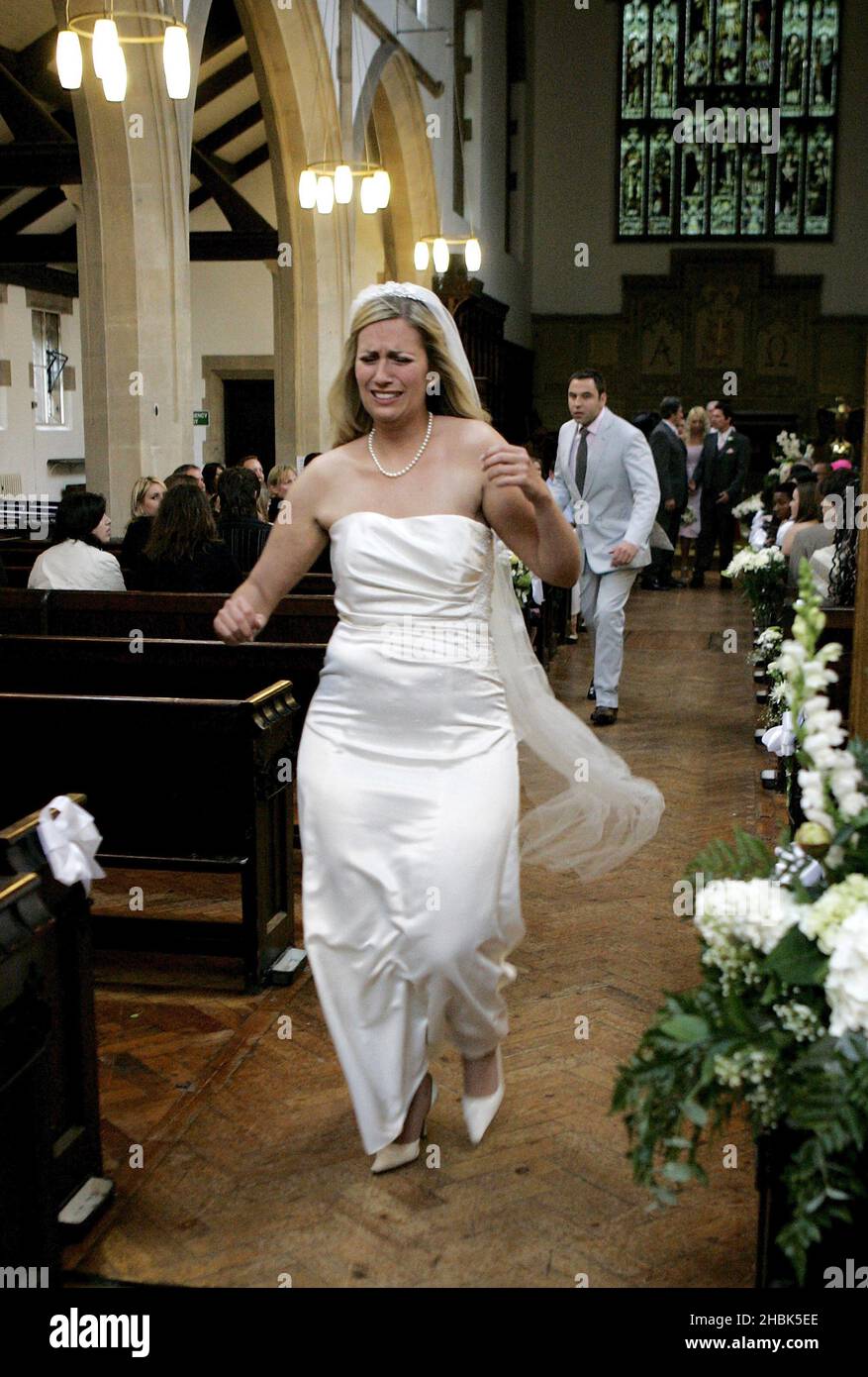 Bride Victoria Kruger runs from the altar in St Luke's Church in ...