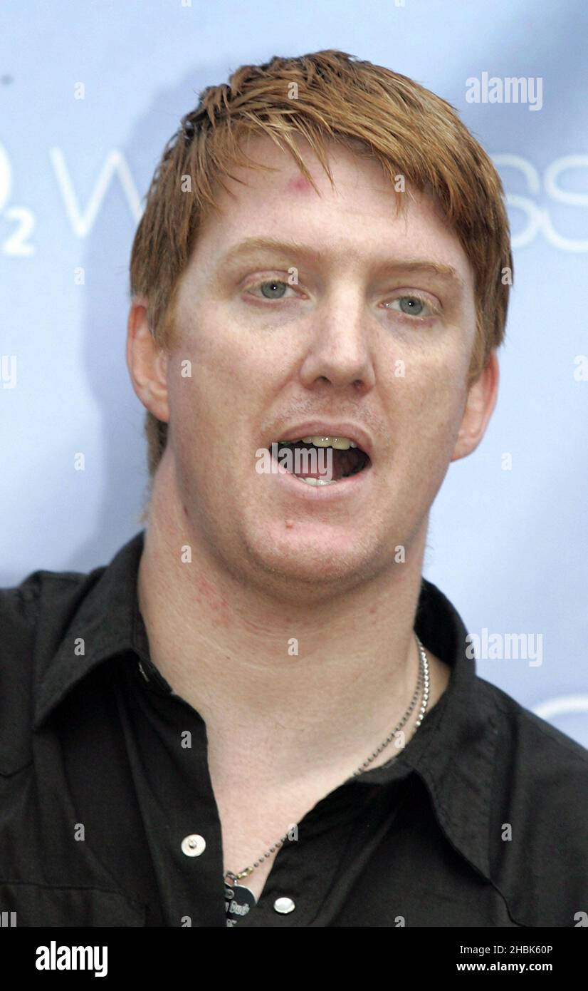 Josh Homme of Queens of the Stone Age pose backstage at the O2 Wireless ...