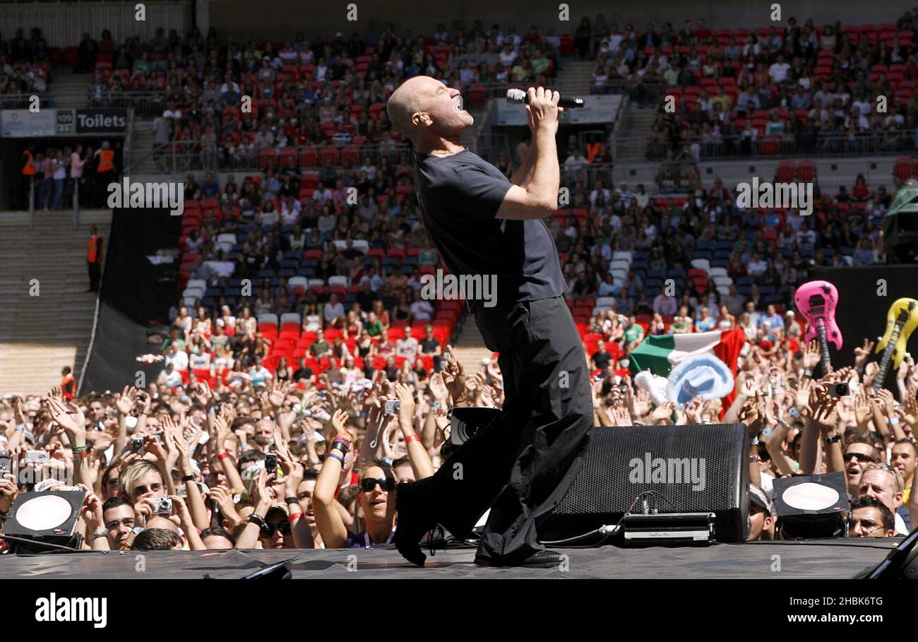 Phil Collins on stage during the Genesis performance during the charity ...
