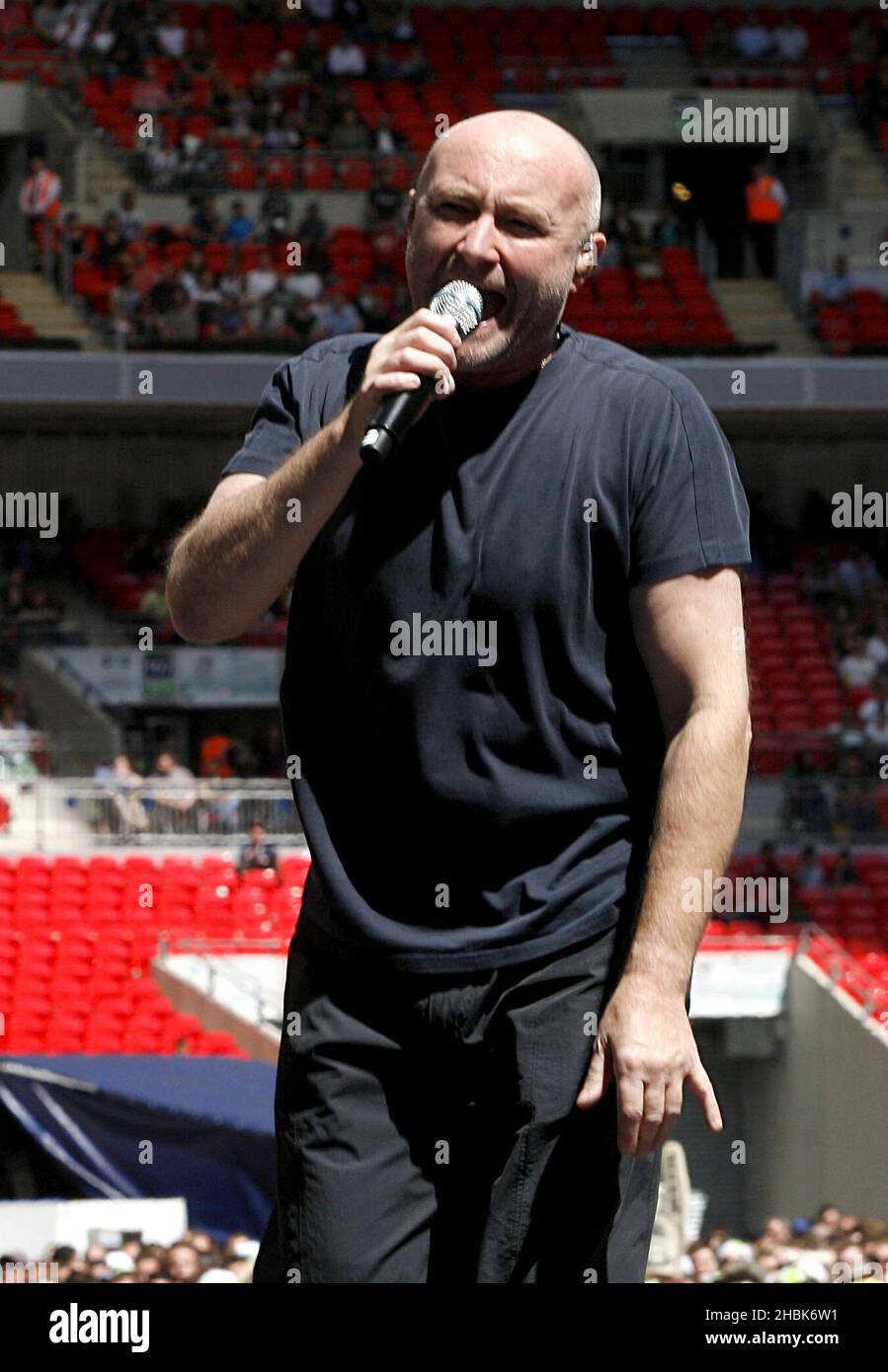 Phil Collins on stage during the Genesis performance during the charity ...