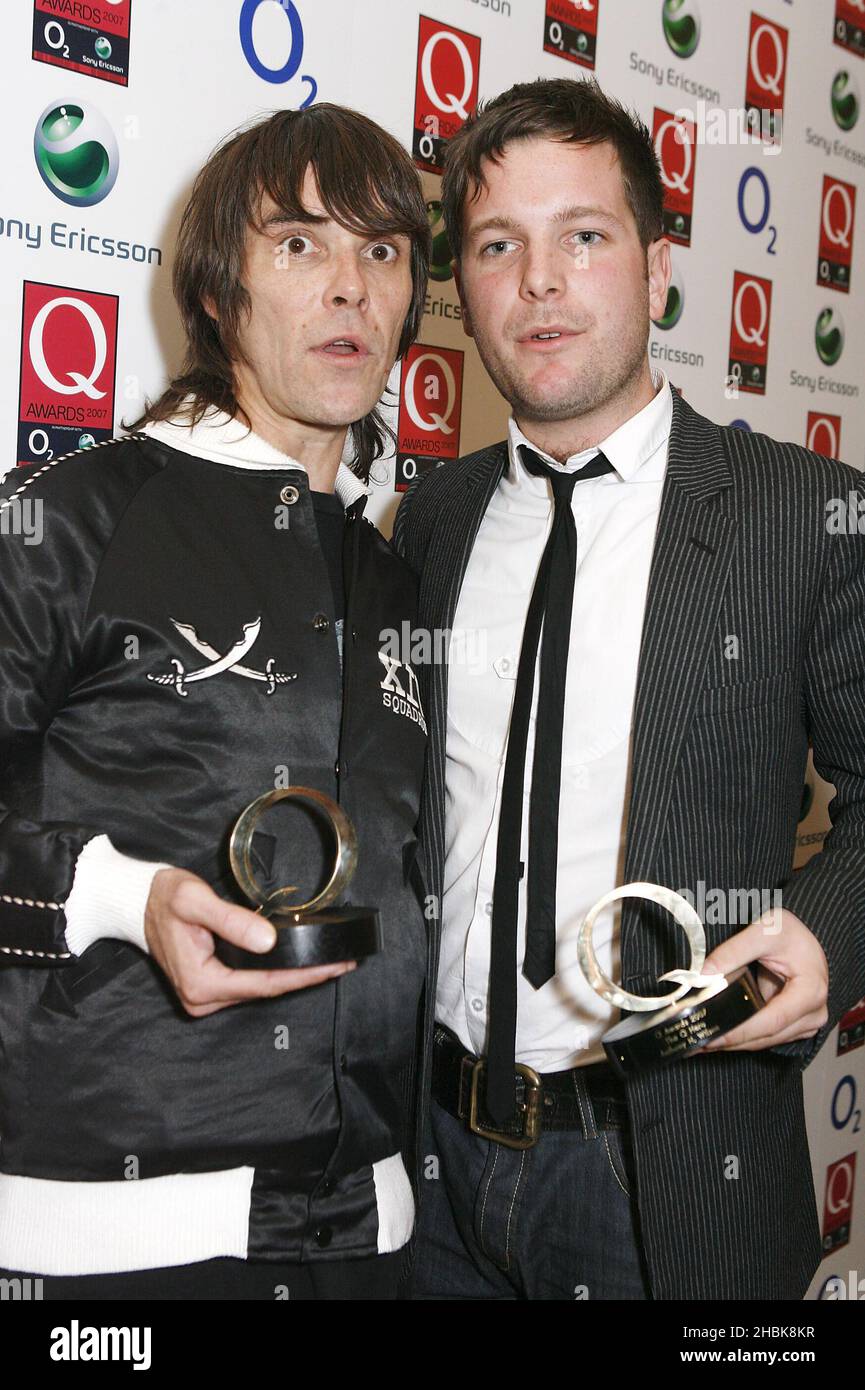 Ian Brown (left) with the Q Legend Award and Oliver Wilson, the son of ...