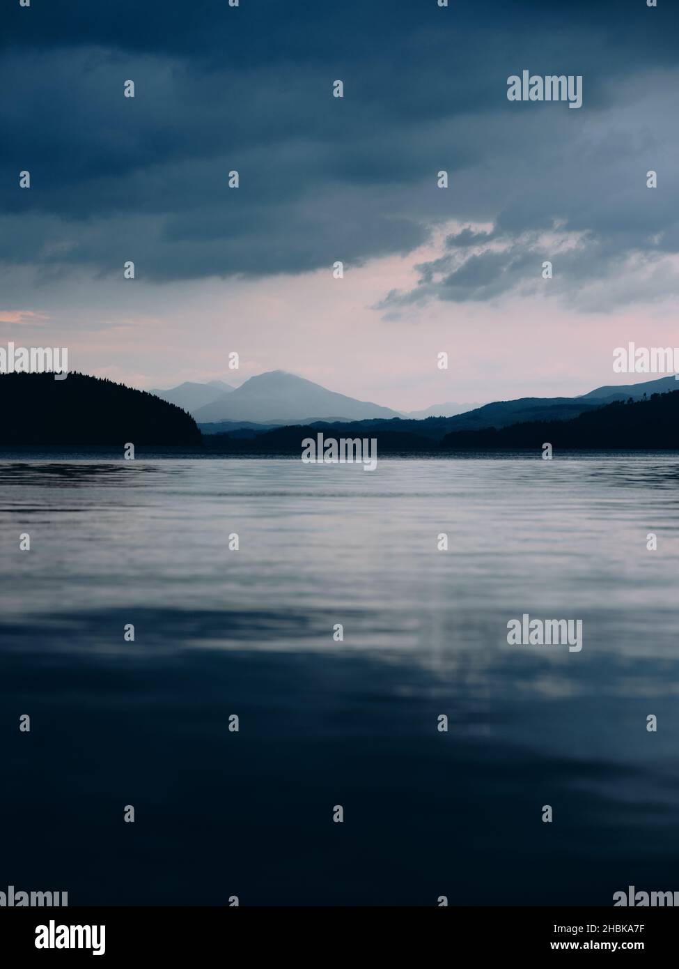 Loch Garry minimal blue dusk still water Scottish loch landscape in the ...