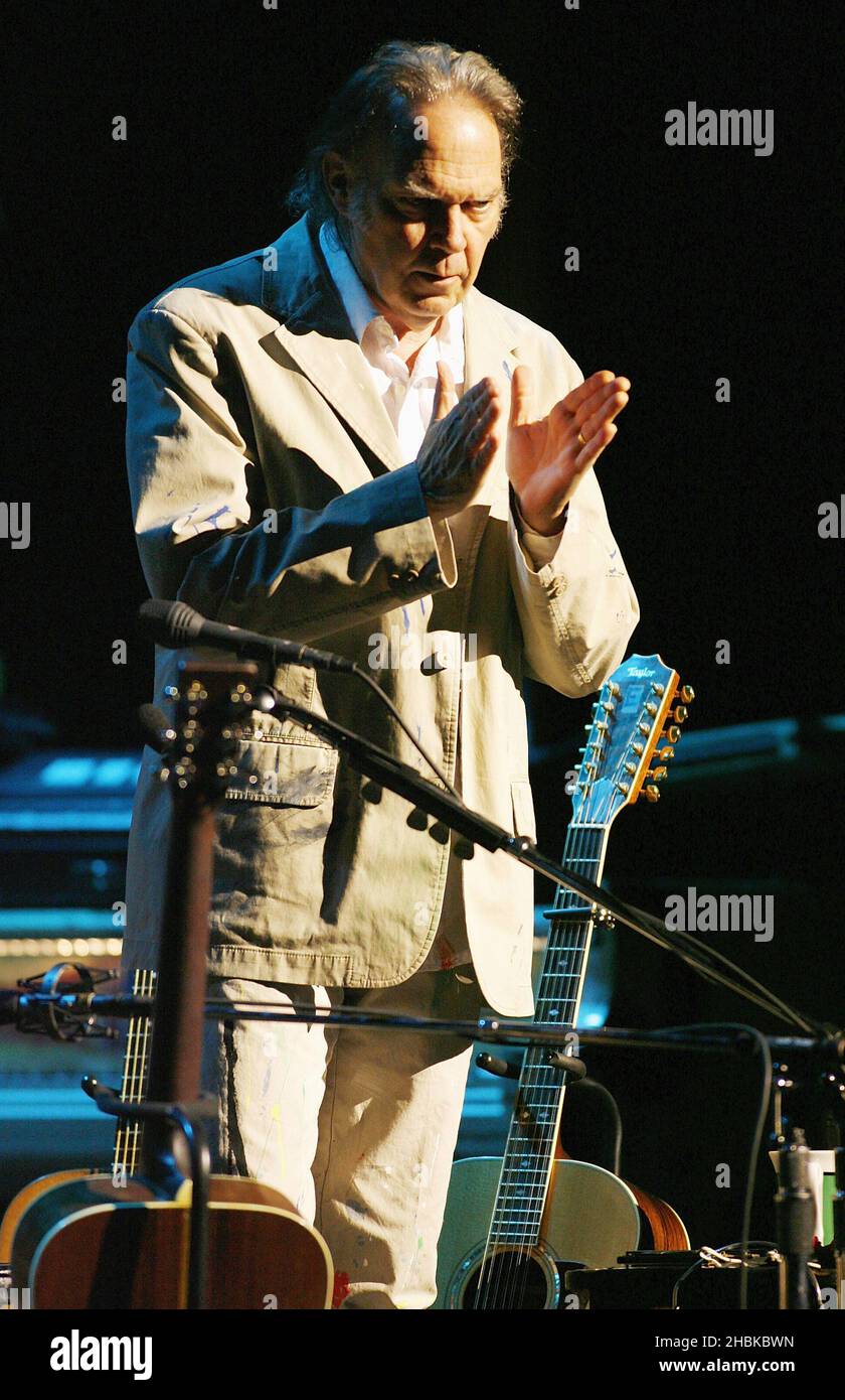 Neil Young performing the acoustic half of his concert at the ...