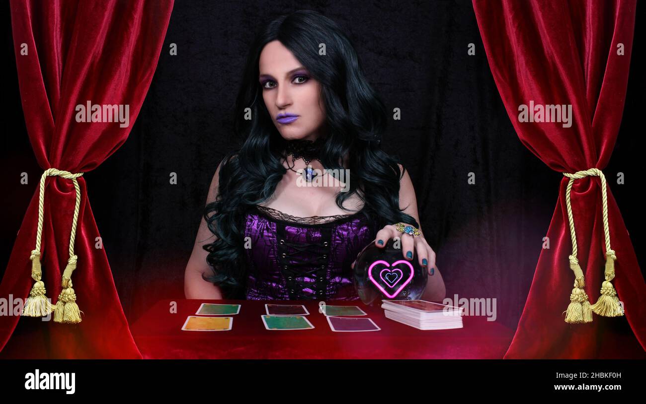 Psychic with Crystal Ball and tarot cards in Red Velvet Tent Stock ...