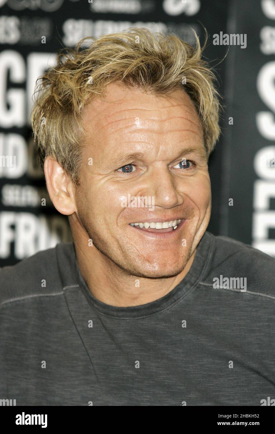 Gordon Ramsay signs copies of his latest book, 'Cooking For Friends ...
