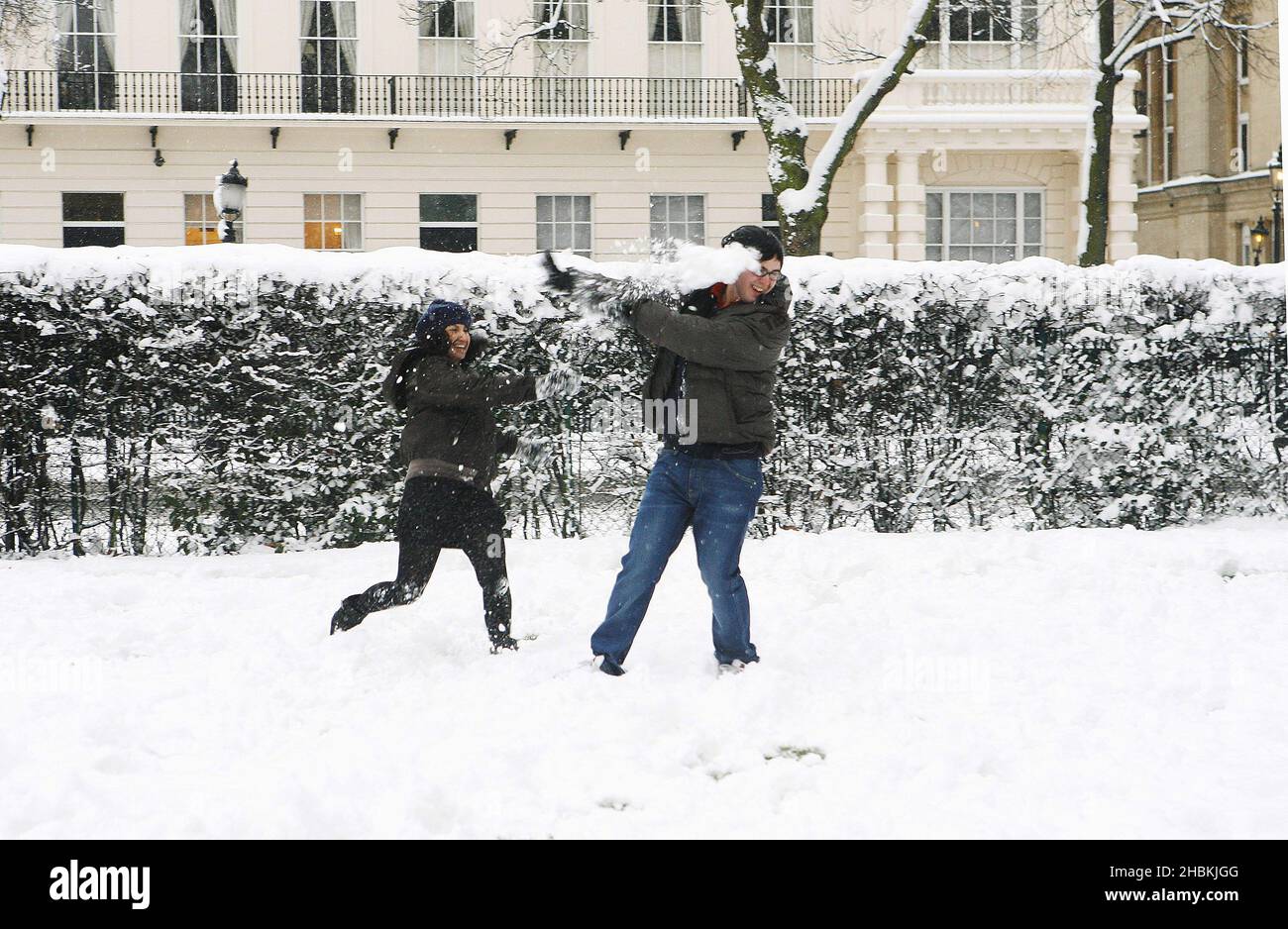 A couple have a snowball fight, in Regent's Park central London Stock ...