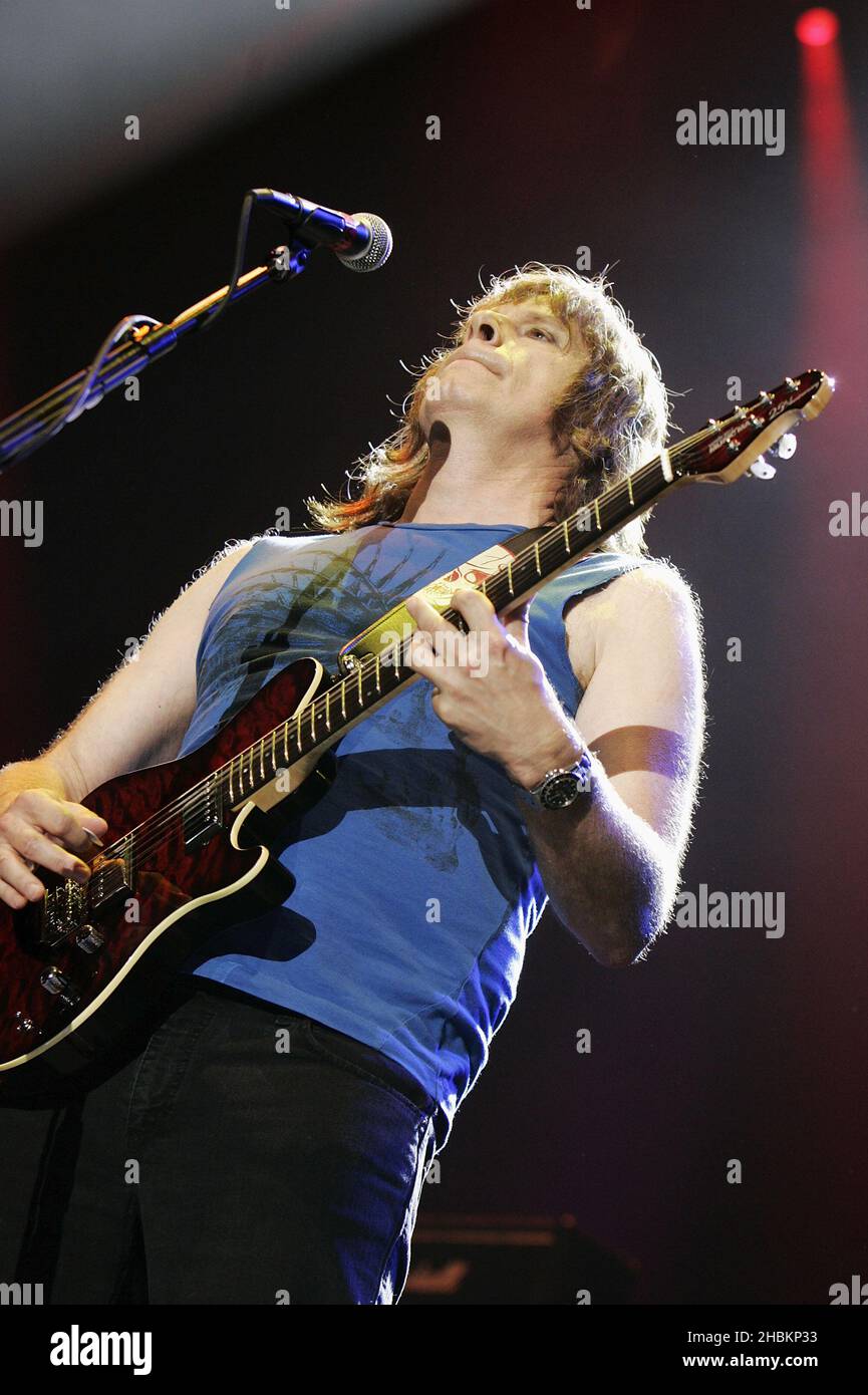 Nigel Tufnel (Christopher Guest) of Spinal Tap performs on stage at ...