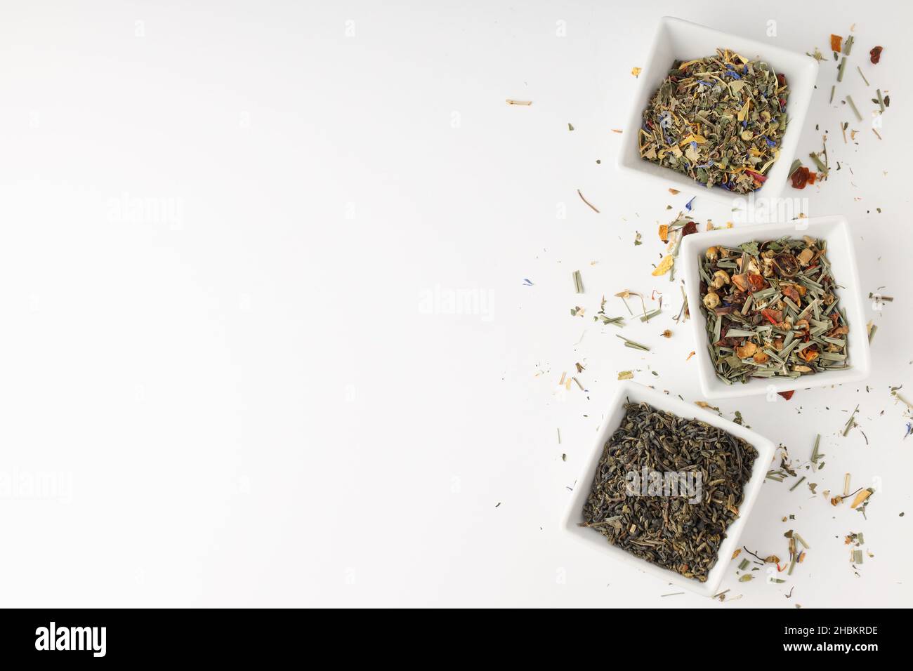Concept of cooking tea with different types of tea on white background ...