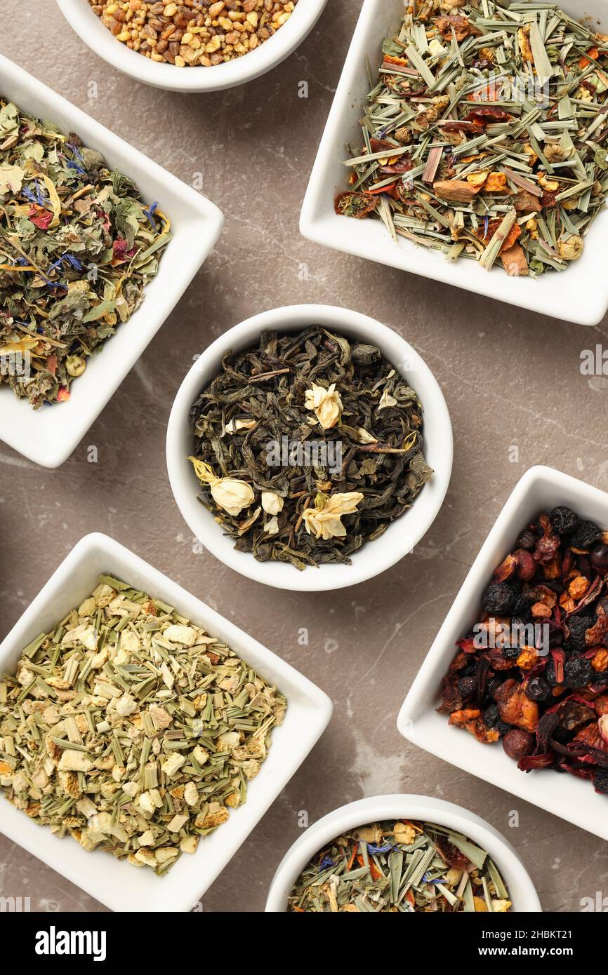 Flat lay with different types of tea on textured background Stock Photo ...