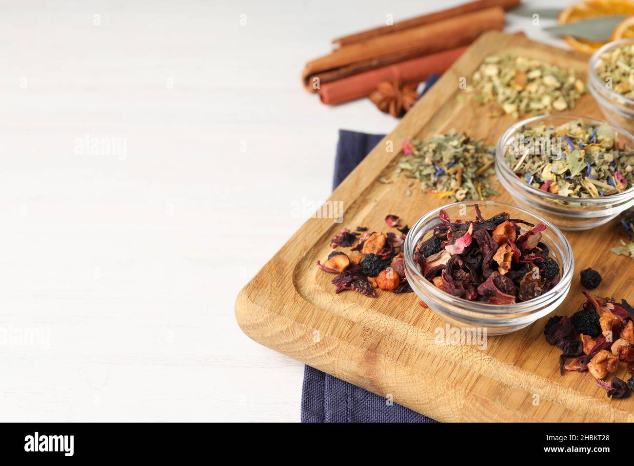 Concept of cooking tea with different types of tea on white wooden ...