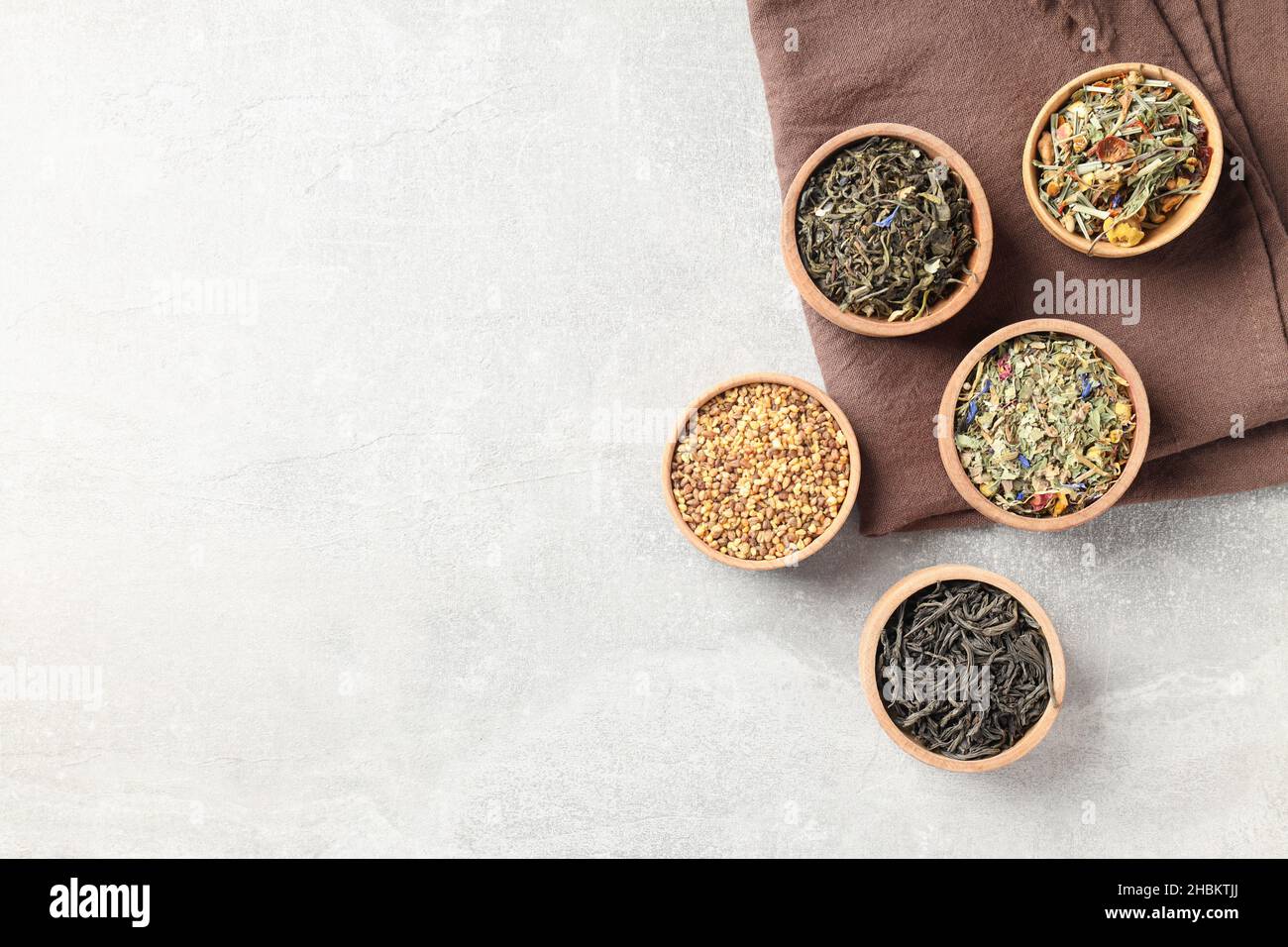 Concept of cooking tea with different types of tea on light textured ...