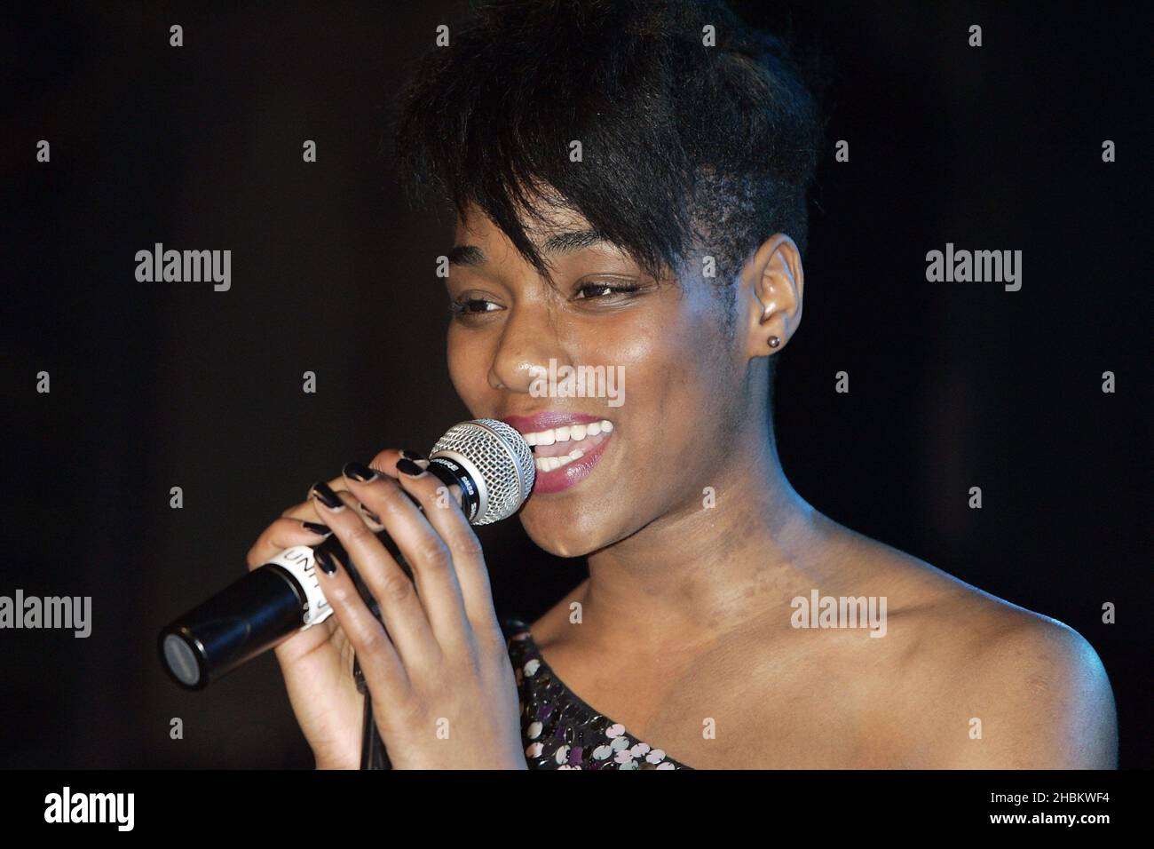 2009 X Factor finalist Rachel Adedeji performs on stage with JLS at G-A ...