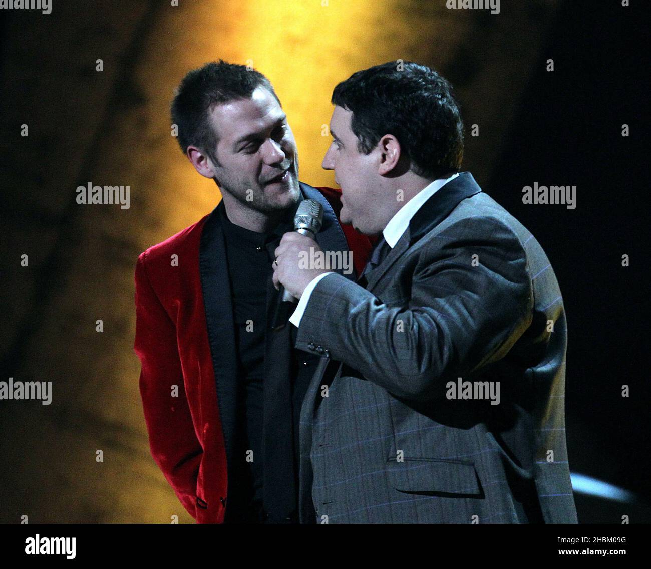 Peter Kay and Tom Meighan of Kasabian on stage during the BRIT Awards ...