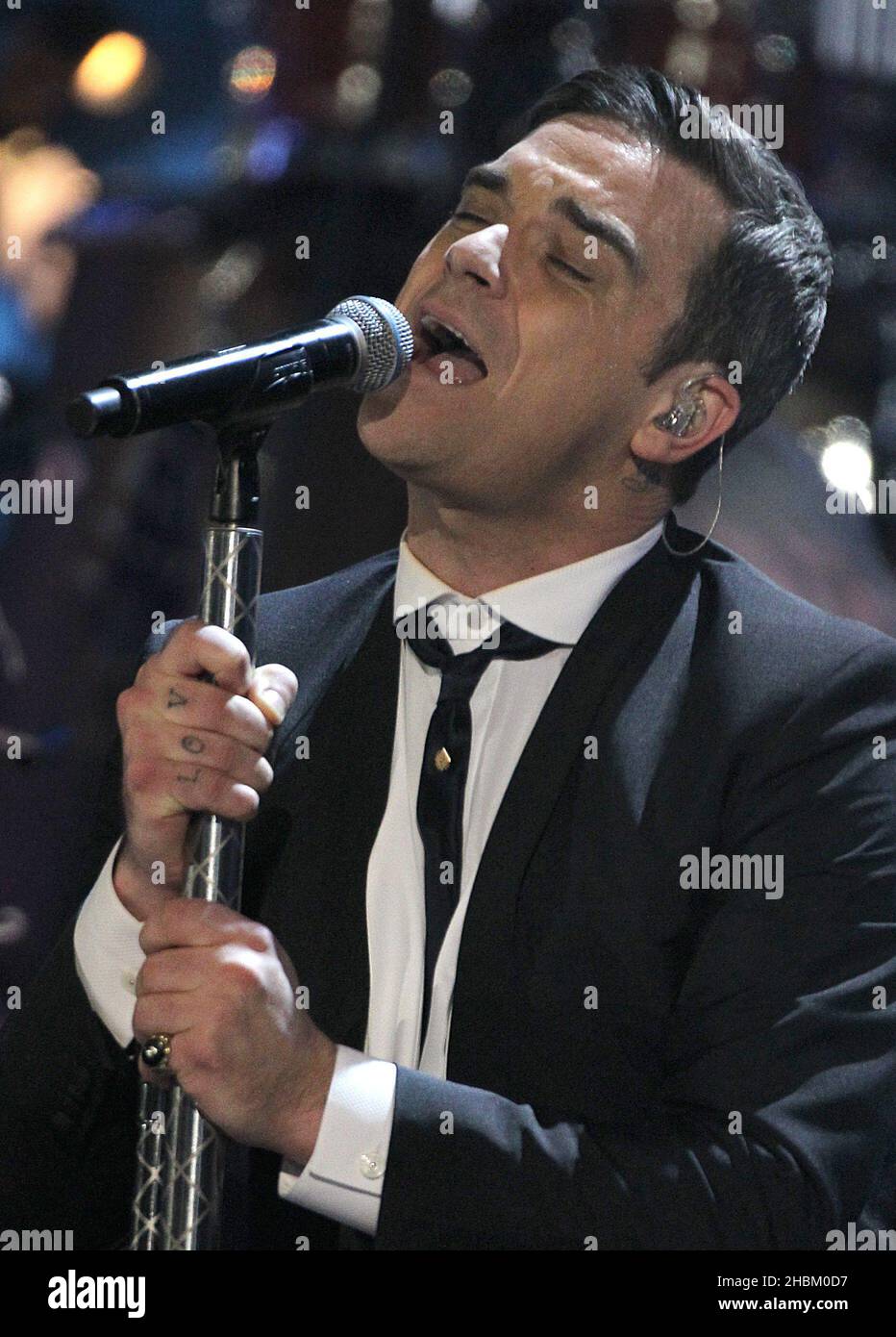 Robbie Williams performs on stage during the BRIT Awards 2010, at Earls ...