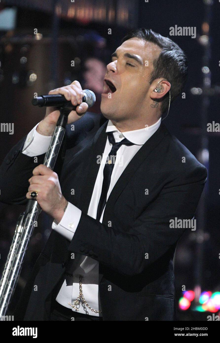 Robbie Williams performs on stage during the BRIT Awards 2010, at Earls ...
