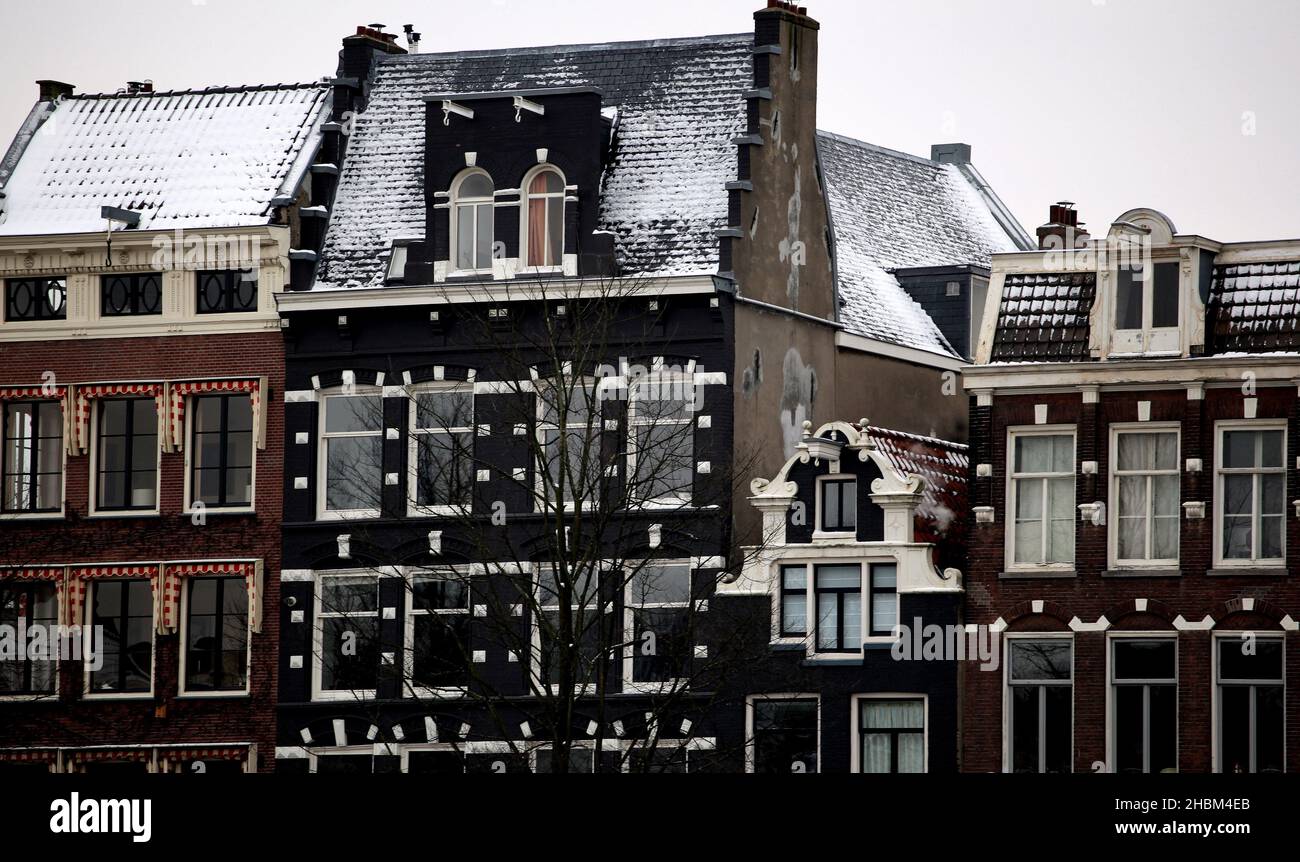 The traditional Amsterdam architecture covered with snow Stock Photo ...