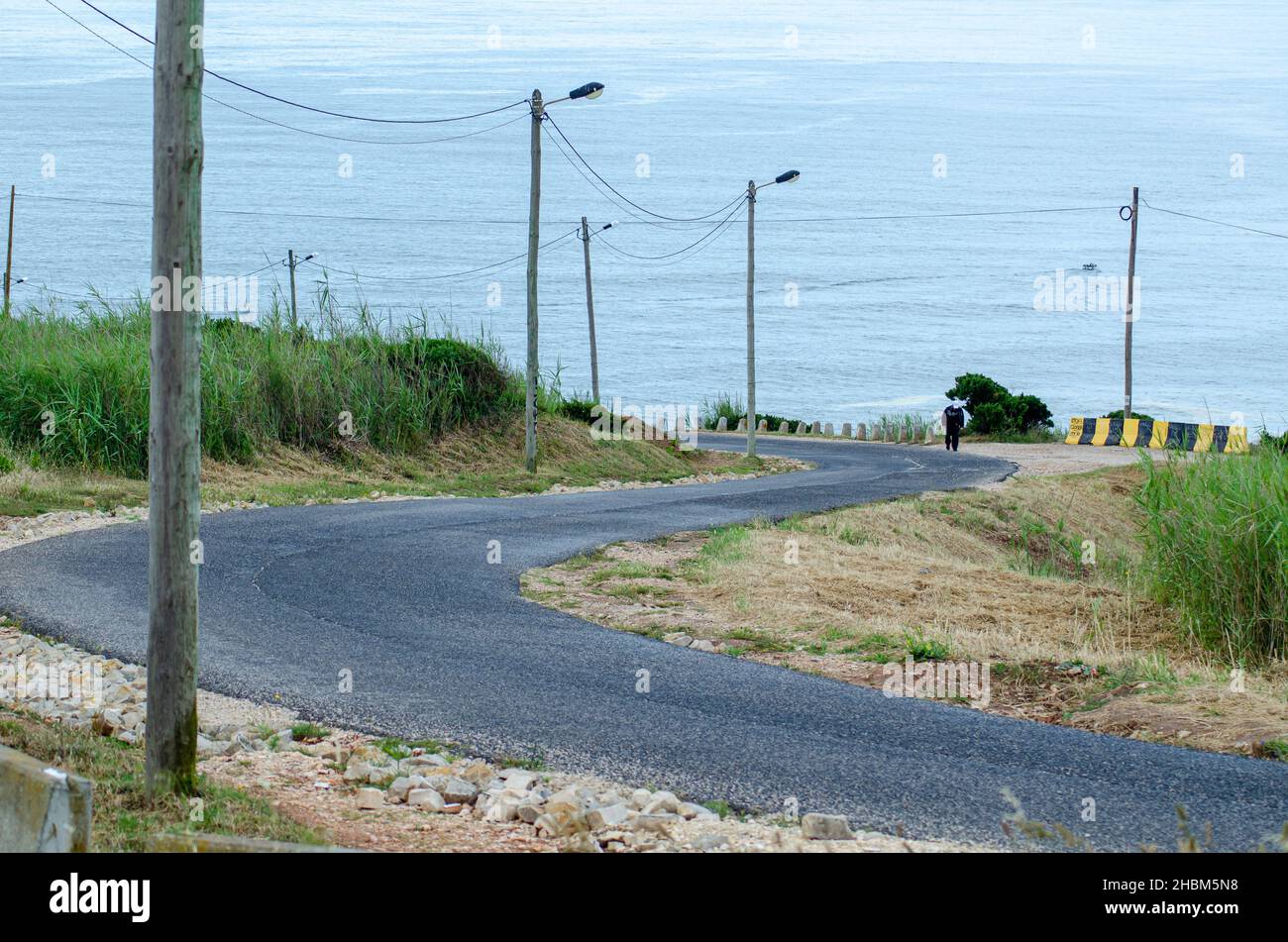 A bendy road with a background of the sea, Nazare, Portugal Stock Photo ...