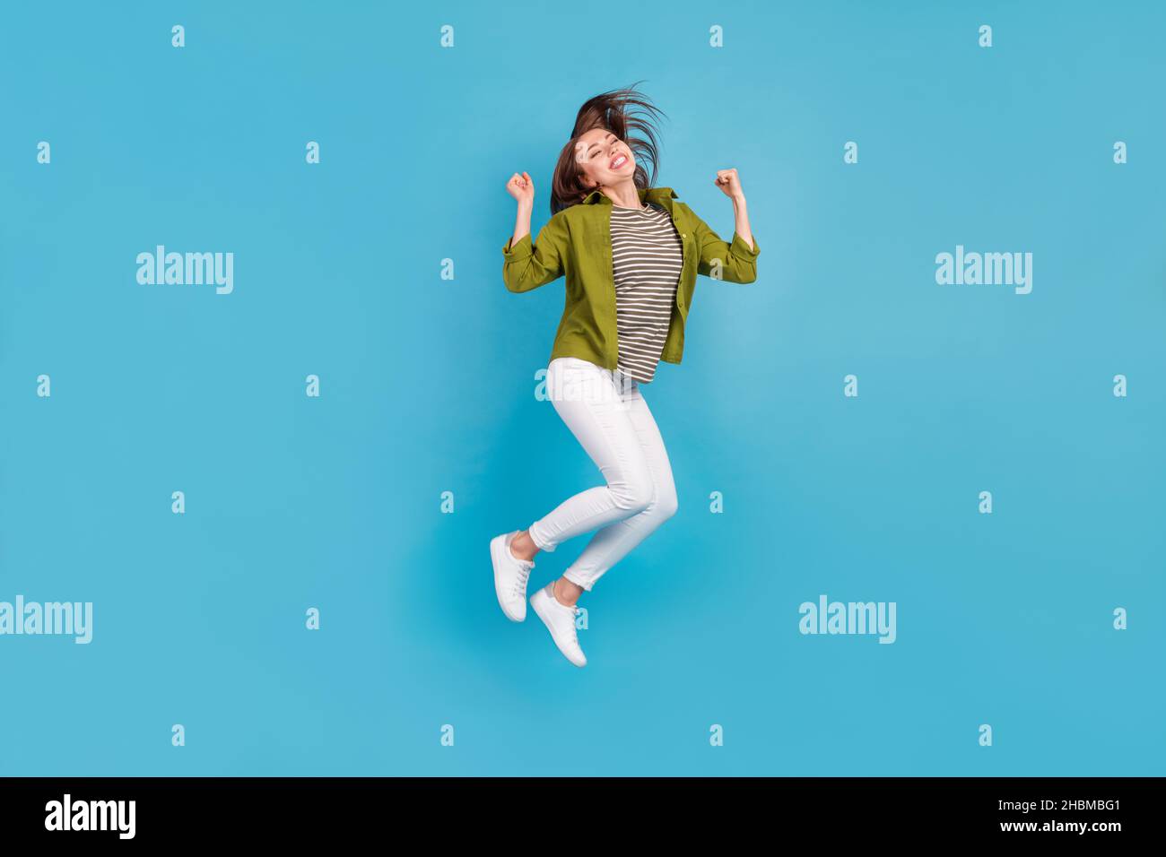 Full size photo of charming cheerful young woman jump up winner ...