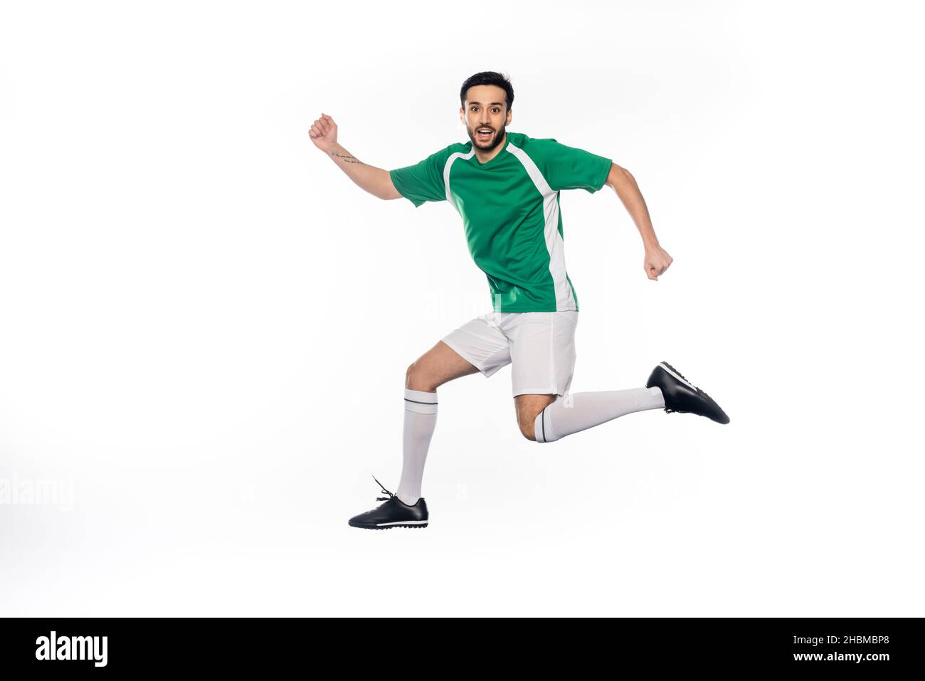 happy young football player in uniform jumping isolated on white Stock ...