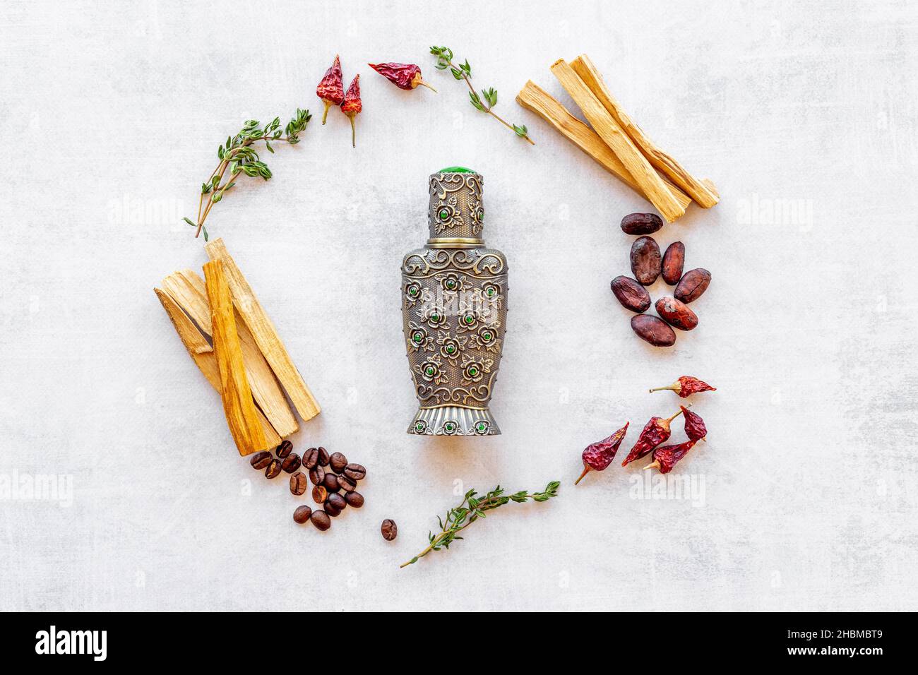 Silver bottle of arabian oud perfume with ingredients Stock Photo - Alamy