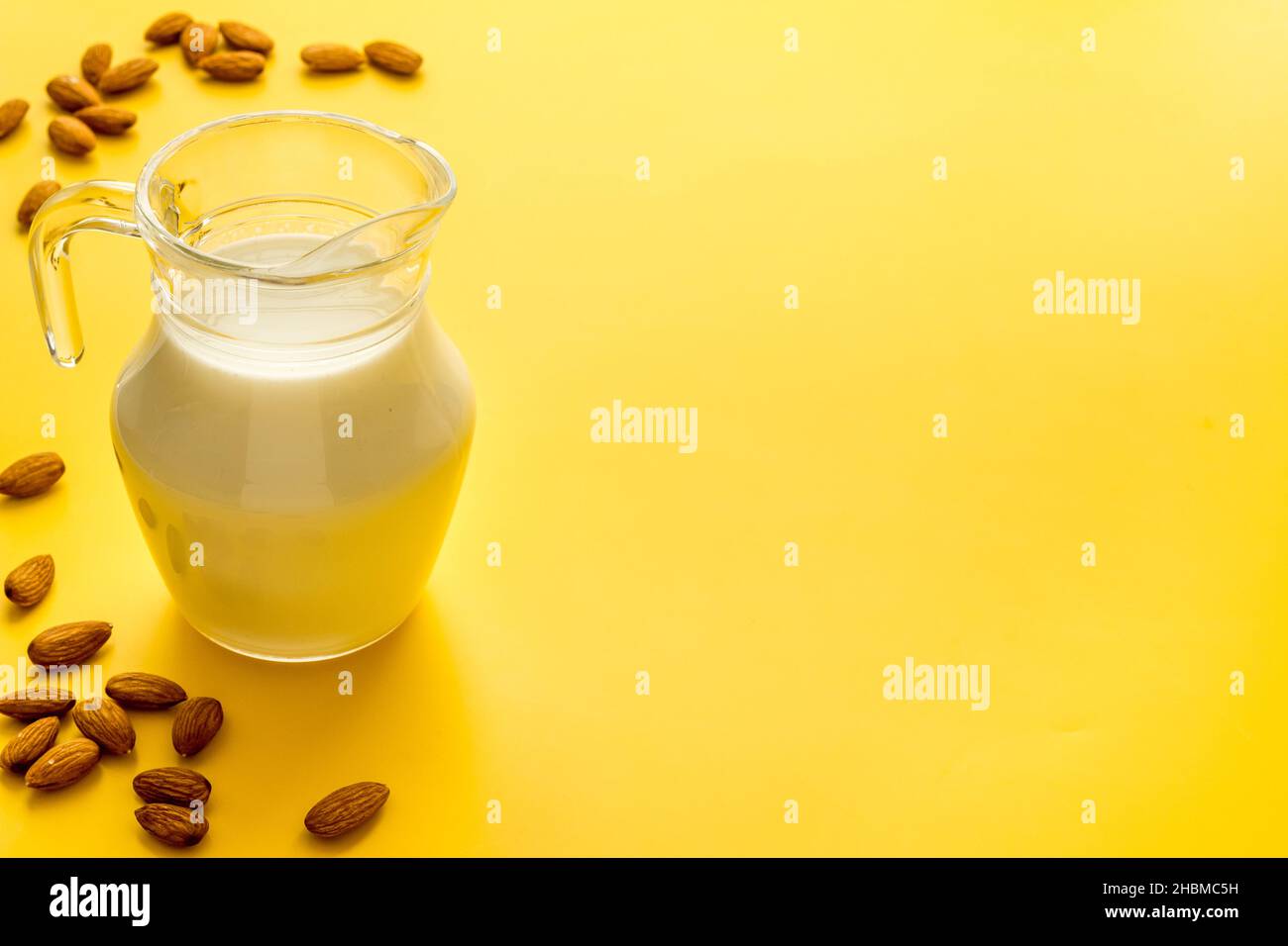 Non dairy vegan milk in glass jar with ingredients, close up Stock Photo - Alamy