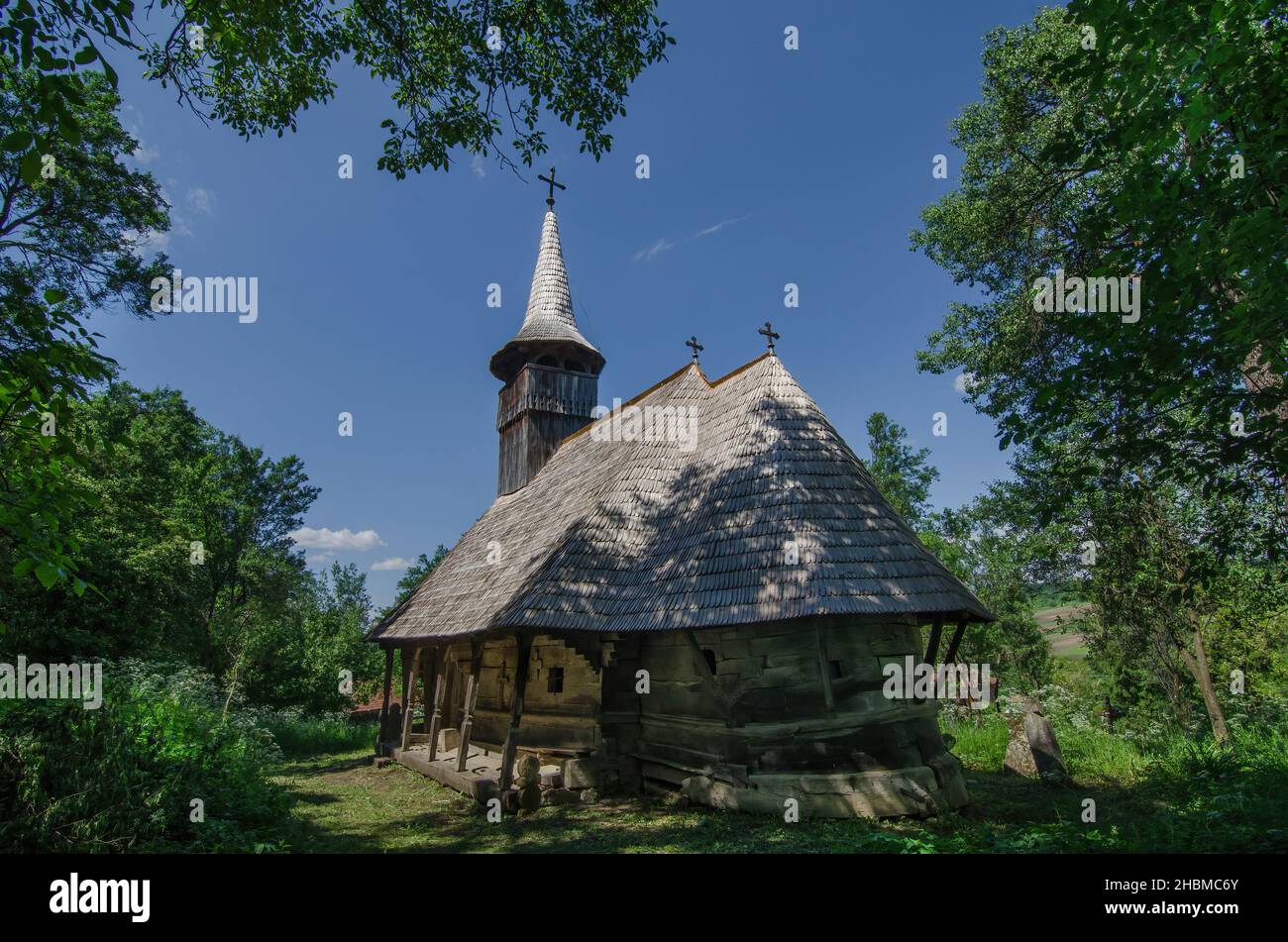 Old Romanian traditional wooden church surrounded by trees in ...
