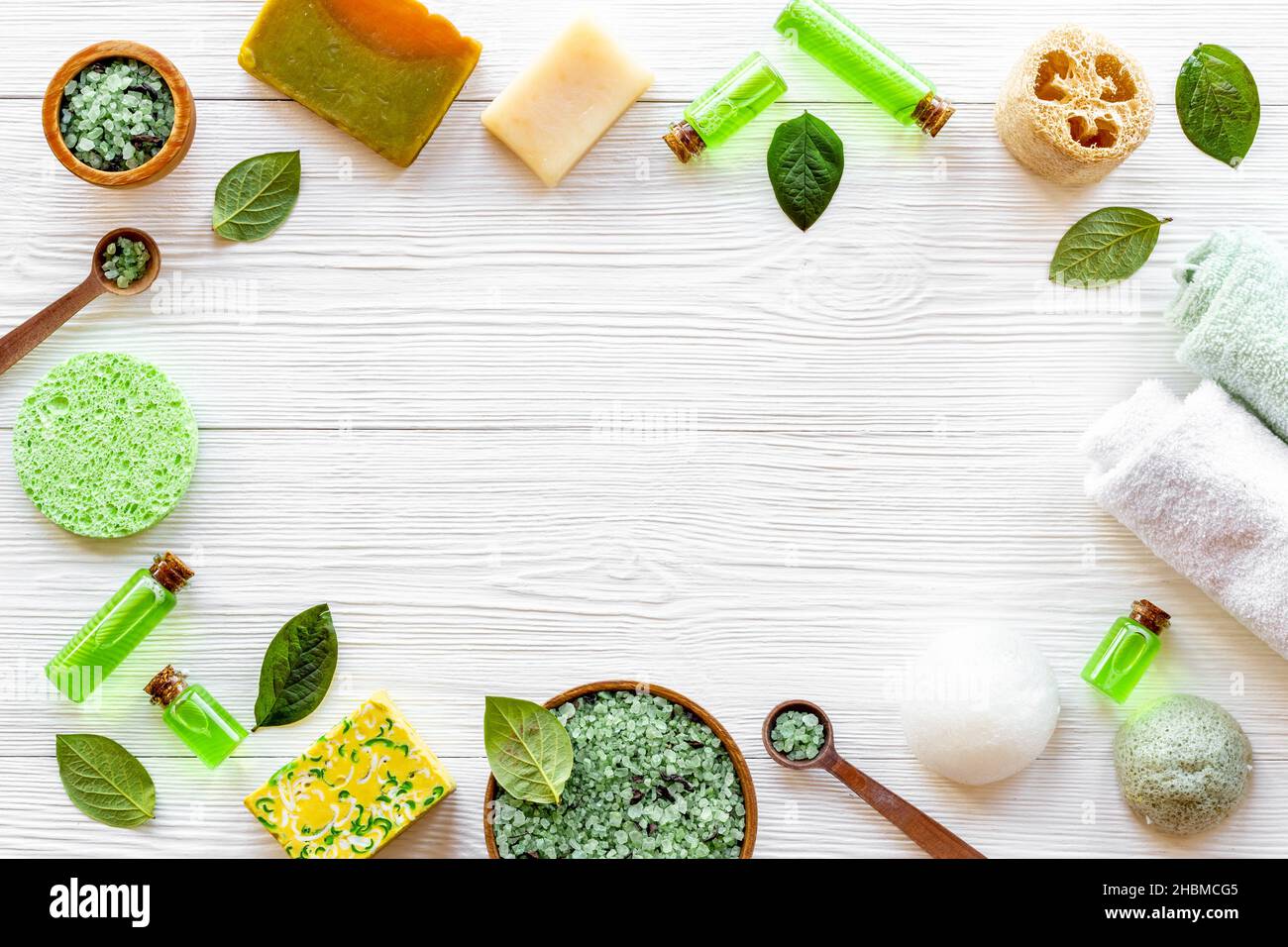 Flay lay of tea cosmetic products with essential oil and green leaves ...