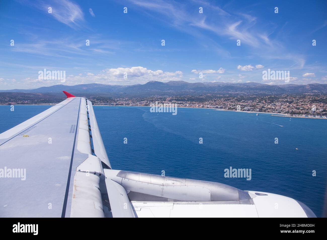 Wing view of arriving airplane in Nice, France Stock Photo - Alamy