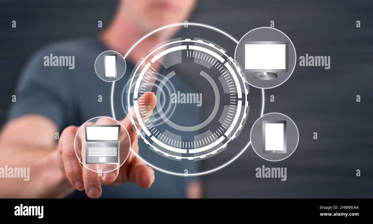 Man touching a device connection concept on a touch screen with his ...