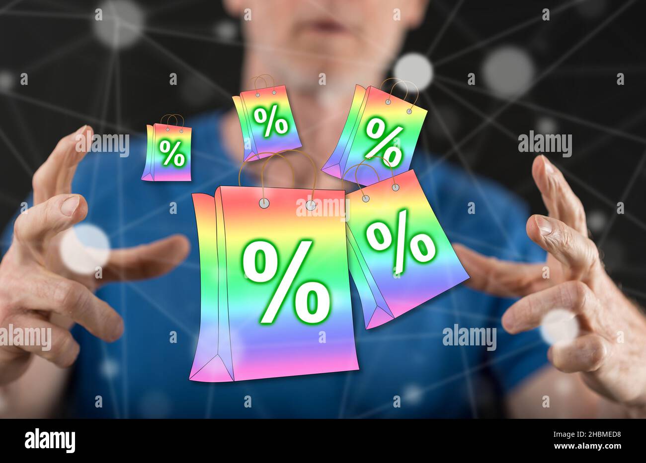 Sales and discounts concept between hands of a man in background Stock ...