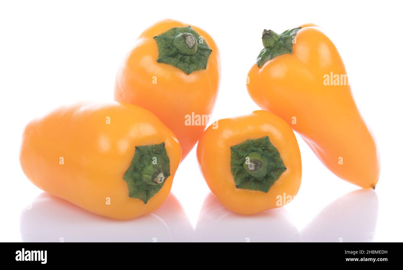 Fresh mini yellow peppers, isolated on white Stock Photo - Alamy