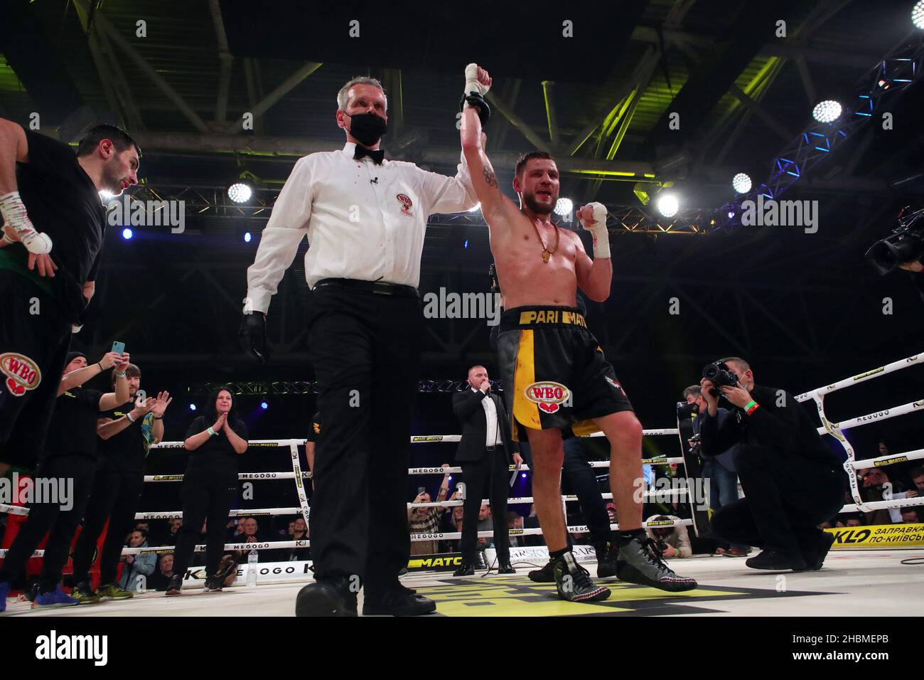 BROVARY, UKRAINE - DECEMBER 18, 2021 - A referee raises a hand of WBO ...