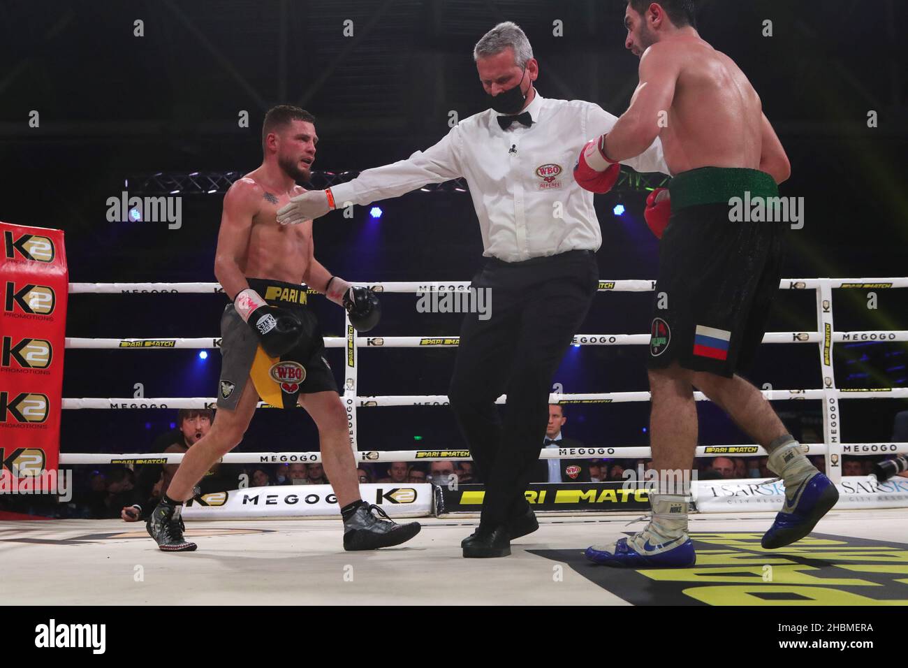BROVARY, UKRAINE - DECEMBER 18, 2021 - A referee stands between WBO ...
