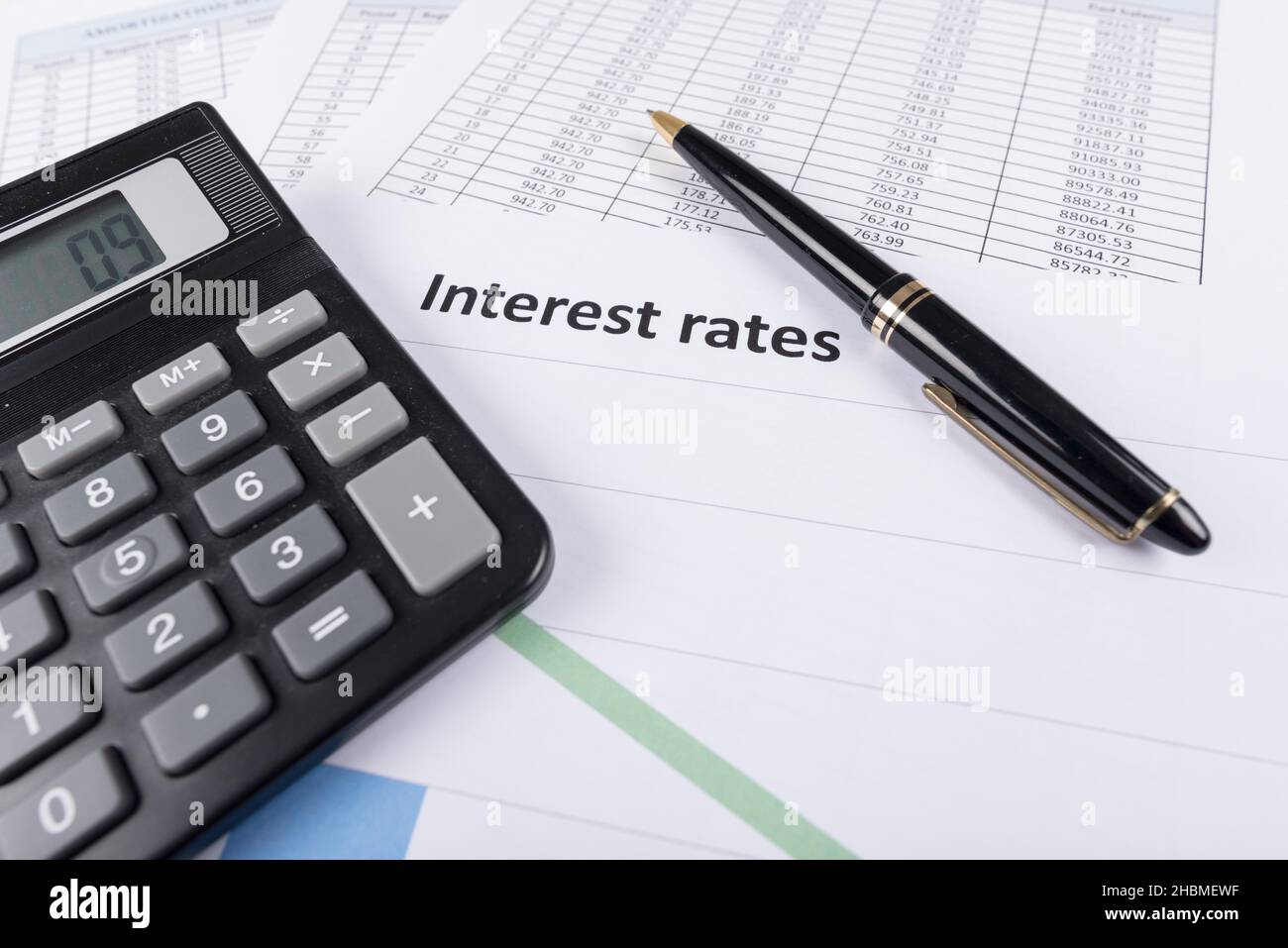 Interest rates documents with calculator Stock Photo - Alamy