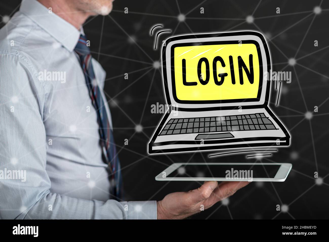 Login concept above a tablet held by a man Stock Photo - Alamy