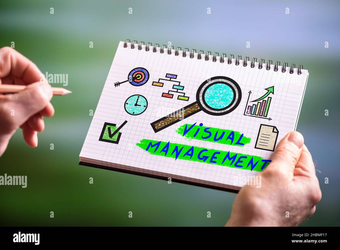 Hand drawing visual management concept on a notepad Stock Photo - Alamy