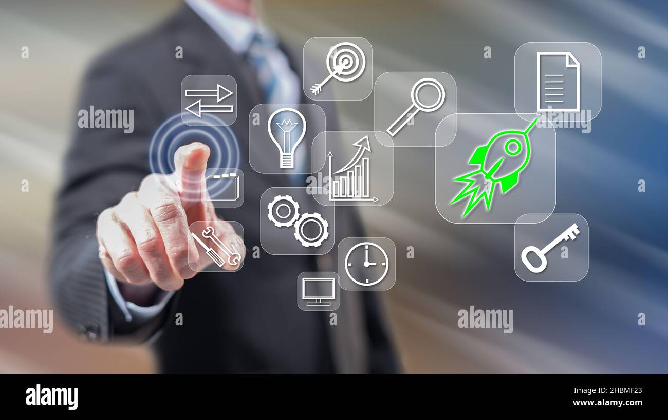 Man touching a start up concept on a touch screen with his fingers ...