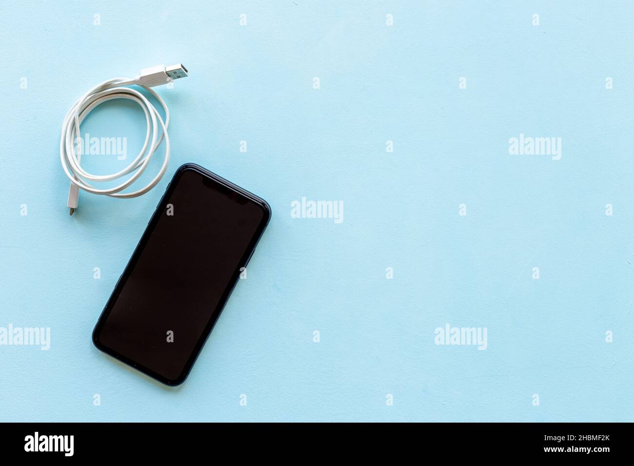 Usb cable for charging smartphone or laptop, top view Stock Photo - Alamy
