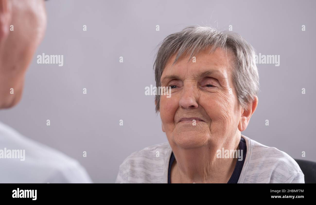 Visiting an elderly person Stock Photo - Alamy