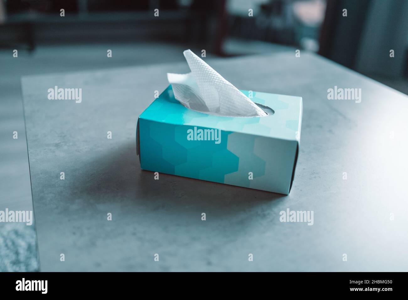 Blue tissue box on the bedside table in the bedroom, minimalism in the ...