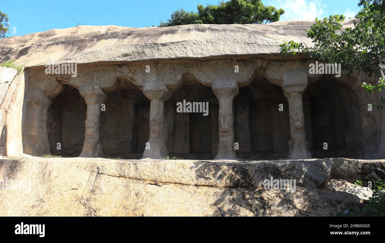 The cave temple carved in the rock and its pillars. It is incomplete ...