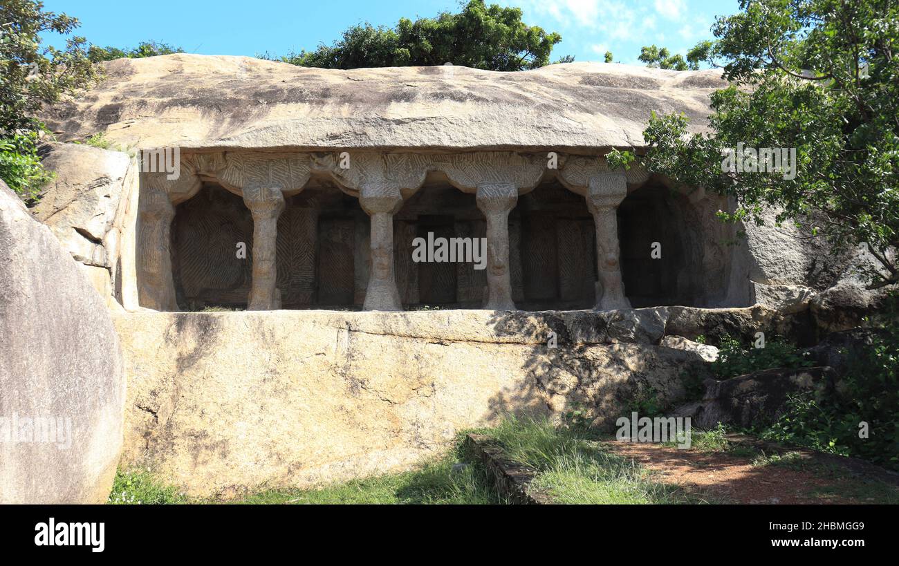 The cave temple carved in the rock and its pillars. It is incomplete ...