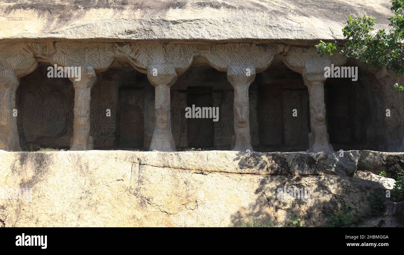 The cave temple carved in the rock and its pillars. It is incomplete ...