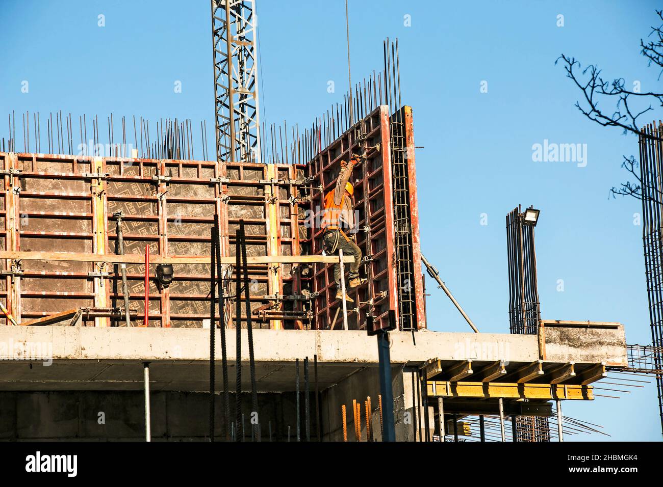 Construction of a high-rise building. Workers prepare formwork for ...
